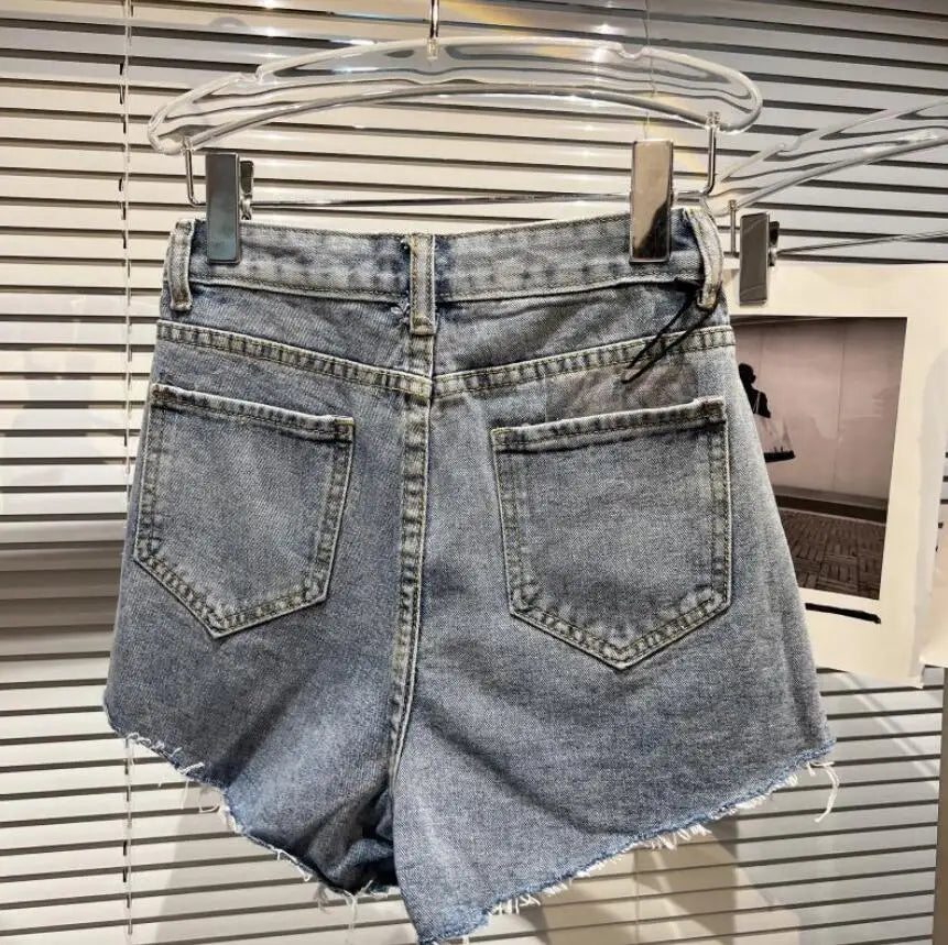 Distressed High-waisted Ripped Denim Shorts With Chains on Luulla