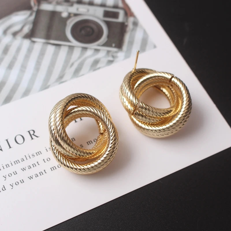 Elegant Gold And Silver Knot Stud Earrings on Luulla
