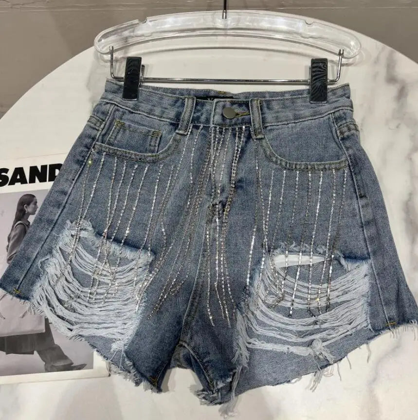 Distressed High-waisted Ripped Denim Shorts With Chains on Luulla