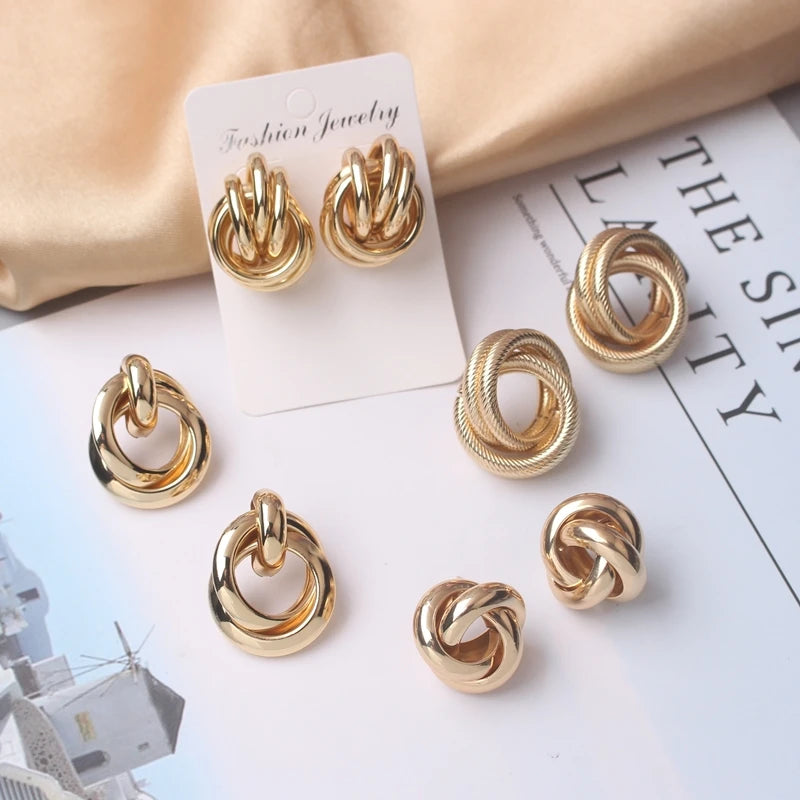 Elegant Gold And Silver Knot Stud Earrings on Luulla