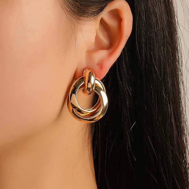 Elegant Gold And Silver Knot Stud Earrings on Luulla